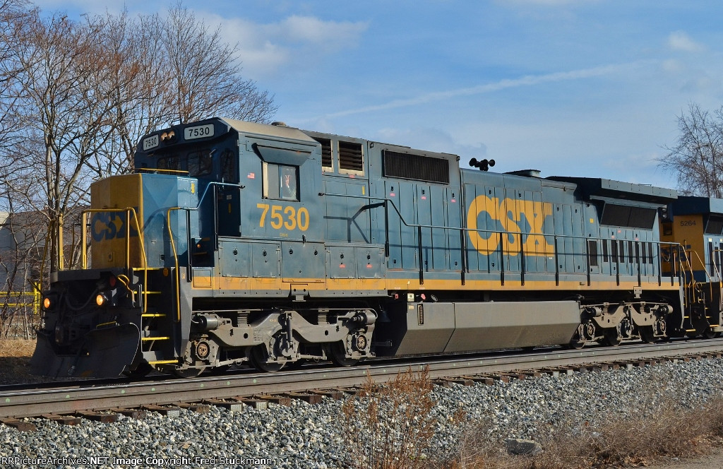 CSX 7530 and a wave.